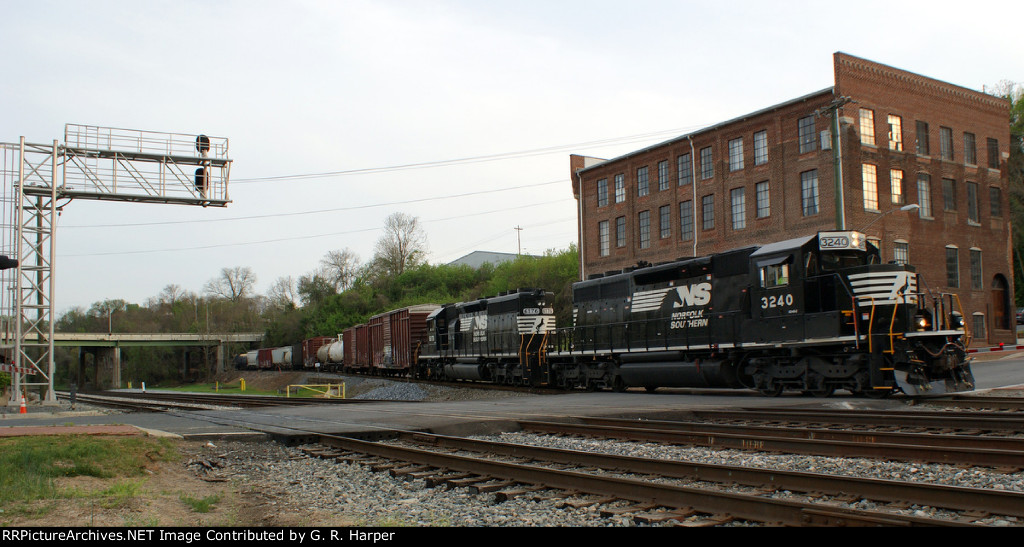 Soon after the K08019 oil train went east i heard the bleating of the NS yard job coming down ...